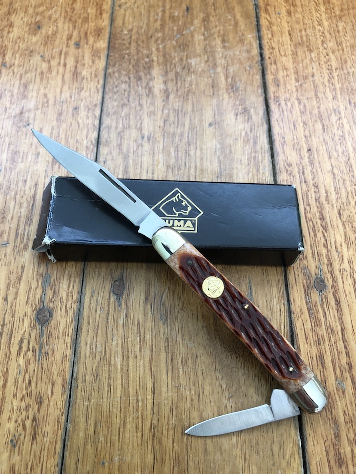 Puma Knife: Puma Bantam Folding Knife with Red Bone Handle Circa early 2000